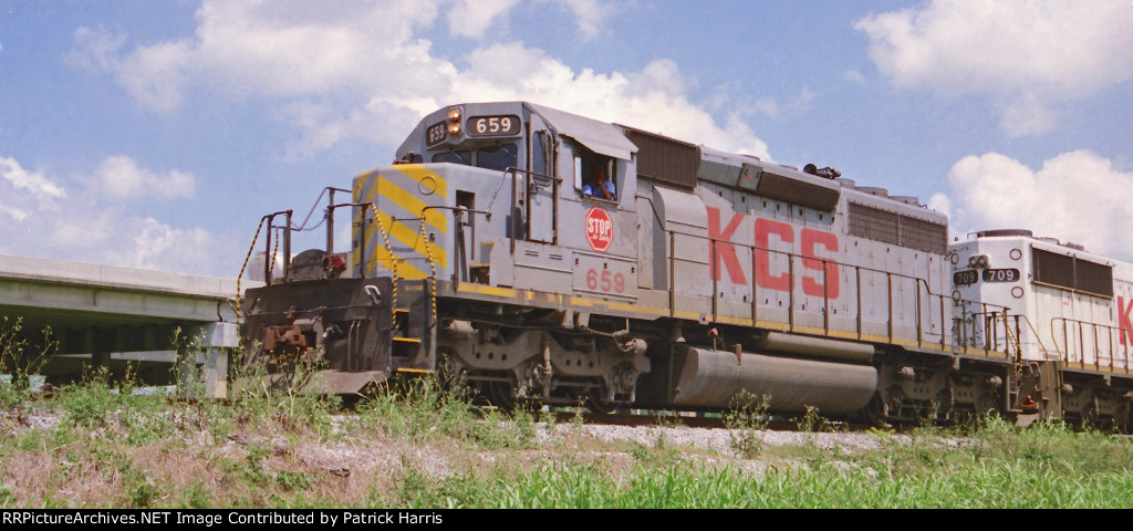 KCS SD40-2 659 and KCS 709 SD50 moving westbound on CSX west of Louisa Street Crossing parallel ...